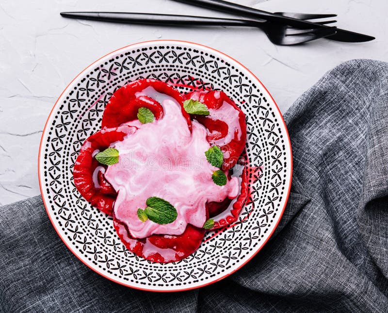 Vegan Red Ravioli with Beetroot on a Plate in Cream Sauce Stock Image ...