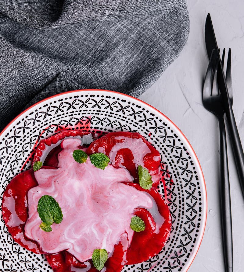Vegan Red Ravioli with Beetroot on a Plate in Cream Sauce Stock Photo ...