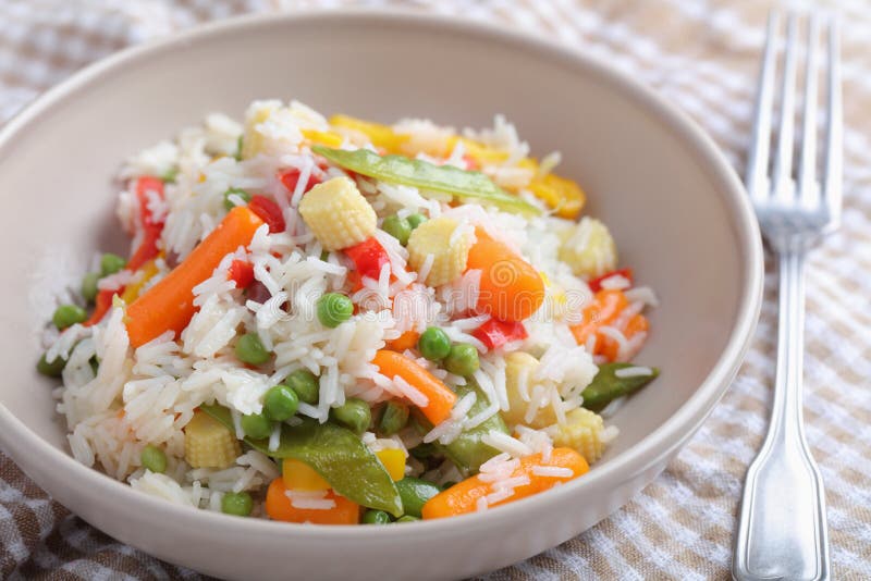 Vegan rice with vegetables stock photo. Image of healthy - 142202312