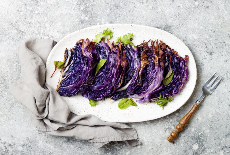 Vegan Roasted Red Cabbage Steaks on Grey Concrete Background. Top View ...