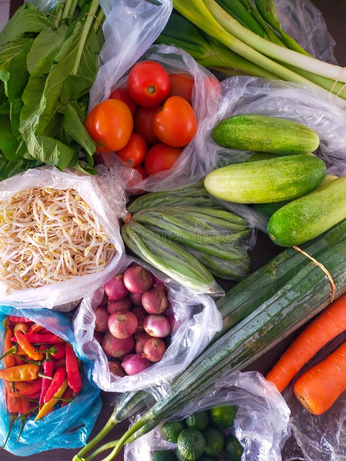 Vegetable Groceries in Plastic Bags on the Table Stock Photo - Image of ...
