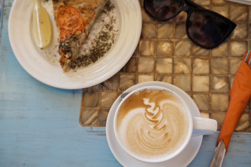 Vegetable Kish and a Cappuccino on the Table in a Cafe Stock Photo ...