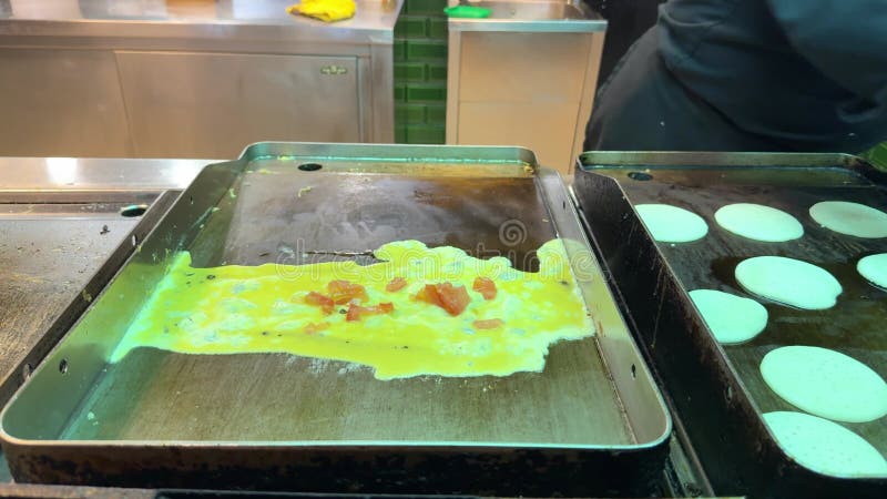 Vegetable Omelet Cooking on a Hot Griddle Next To Round Pancakes, Slow ...