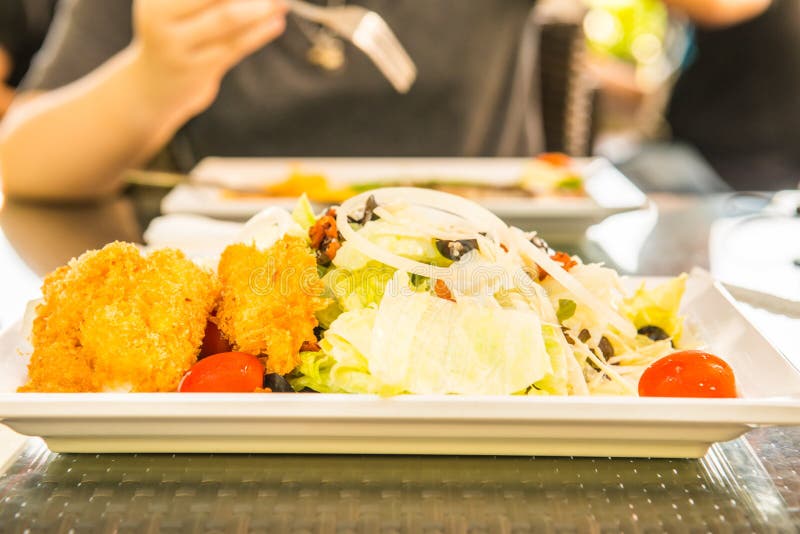 Vegetable Salad with Breaded Fried Fish Stock Image - Image of salad ...