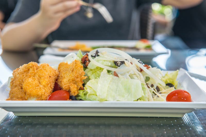 Vegetable Salad with Breaded Fried Fish Stock Image - Image of gourmet ...
