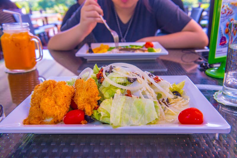 Vegetable Salad with Breaded Fried Fish Stock Image - Image of lunch ...