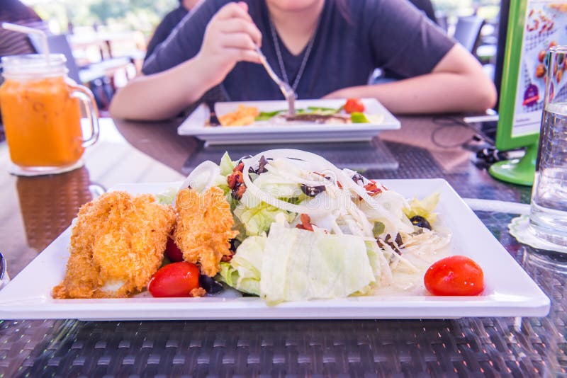 Vegetable Salad with Breaded Fried Fish Stock Photo - Image of cuisine ...