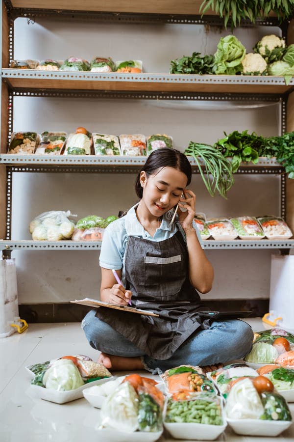 Vegetable Seller Wearing Apron Calling Using a Phone Stock Photo ...