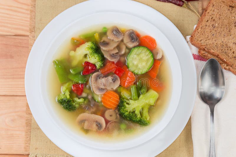 Vegetable Soup with Mushrooms Serving on Rustic Table, Top View Stock ...