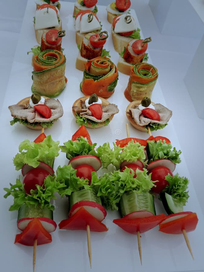 Vegetable Starters on Skewers and Ham Appetizers on White Table Stock ...