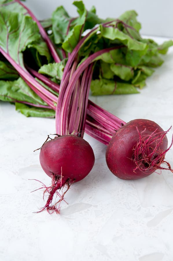 Vegetable Still Life: Two Beets with Tops on the Table Stock Photo ...