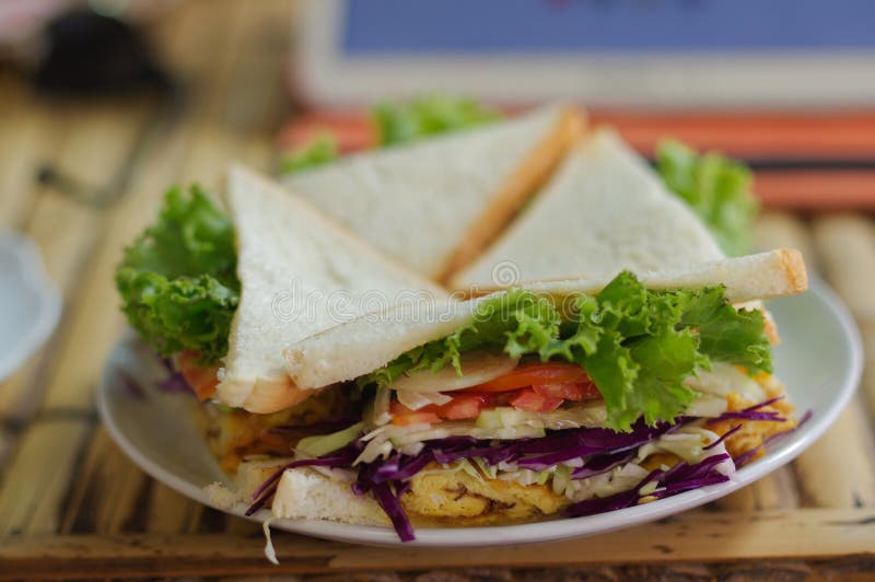 Vegetable Triangle Sandwiches and Crisps on a Wooden Table in R Stock ...