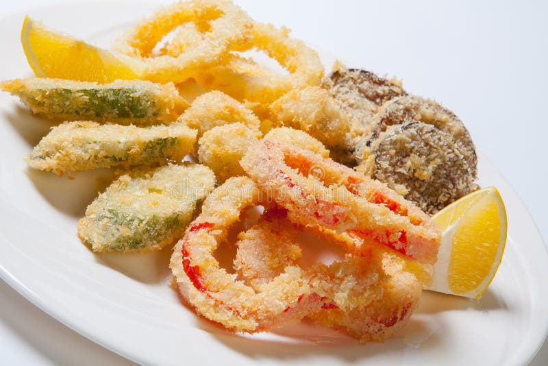 Vegetables in Batter. Onion Rings, Pepper Eggplant Zucchini and Lemon ...