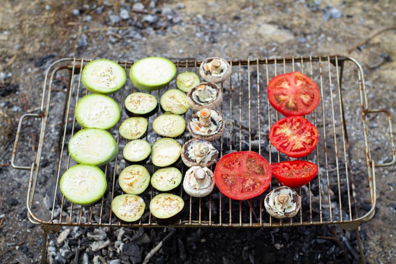 Vegetables on a Camp Fire Barbecue while Camping Outdoors Stock Photo ...