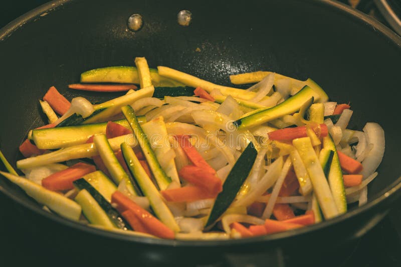 Vegetables cooked in a wok stock photo. Image of cooking - 174669926