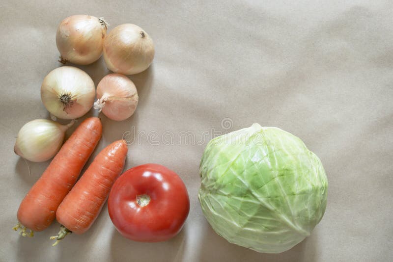 Vegetables on craft paper stock photo. Image of onions - 193556666