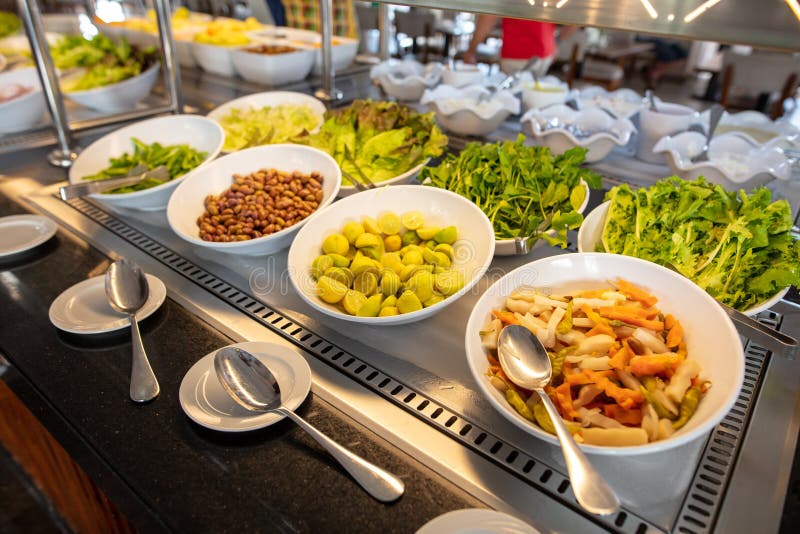 Vegetables with Greens in Plates on Display in the Dining Room. Stock ...