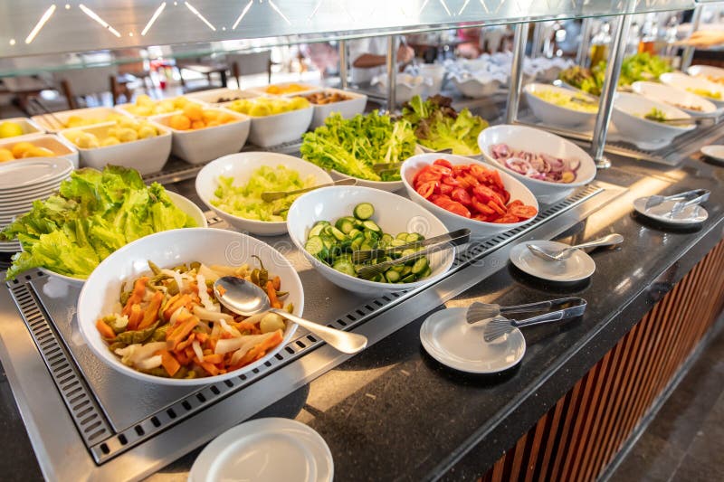 Vegetables with Greens in Plates on Display in the Dining Room. Stock ...