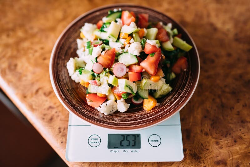 Vegetables on the scales stock photo. Image of dieting - 87144282