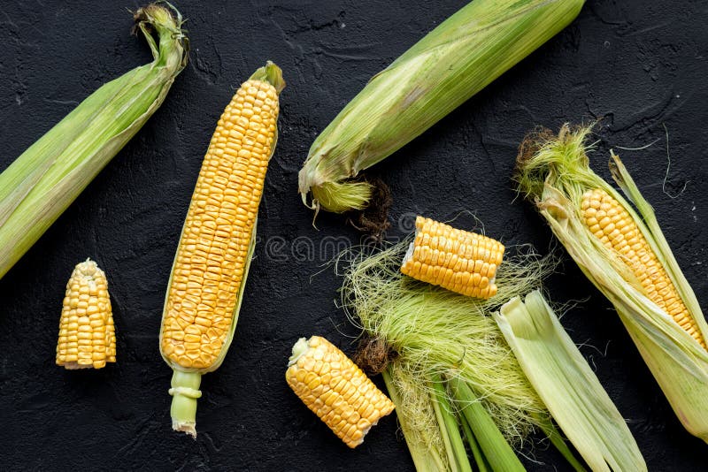 Vegetarian Food. Corn Cobs on Black Stone Background Top View Stock ...