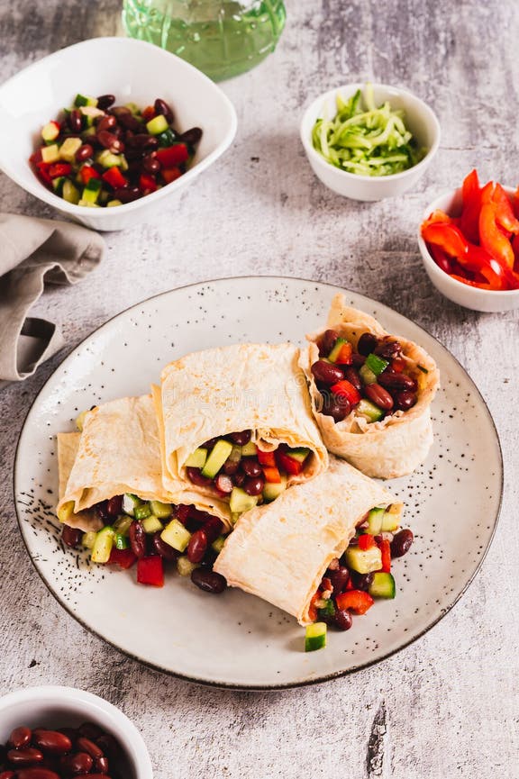 Vegetarian Salsa Rolls in Tortilla on Plate on Table Vertical View ...