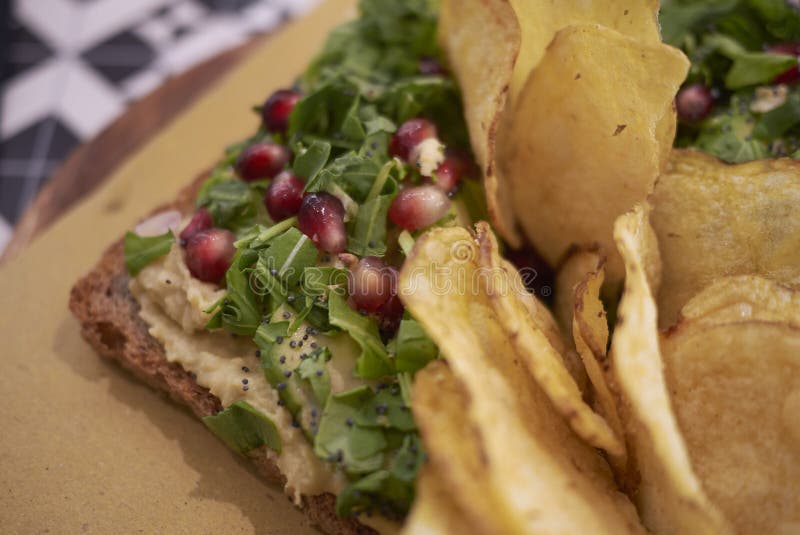 Vegetarian Toast with Rocket, Hummus and Pomegranate Stock Photo ...