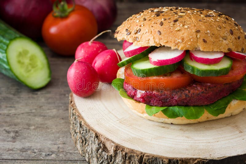 Veggie Beet Burger on a Rustic Wood Stock Photo - Image of fresh ...