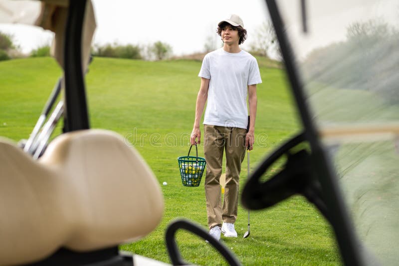 Vehicle in a Golf Club with Young Golfers Inside Stock Photo - Image of ...