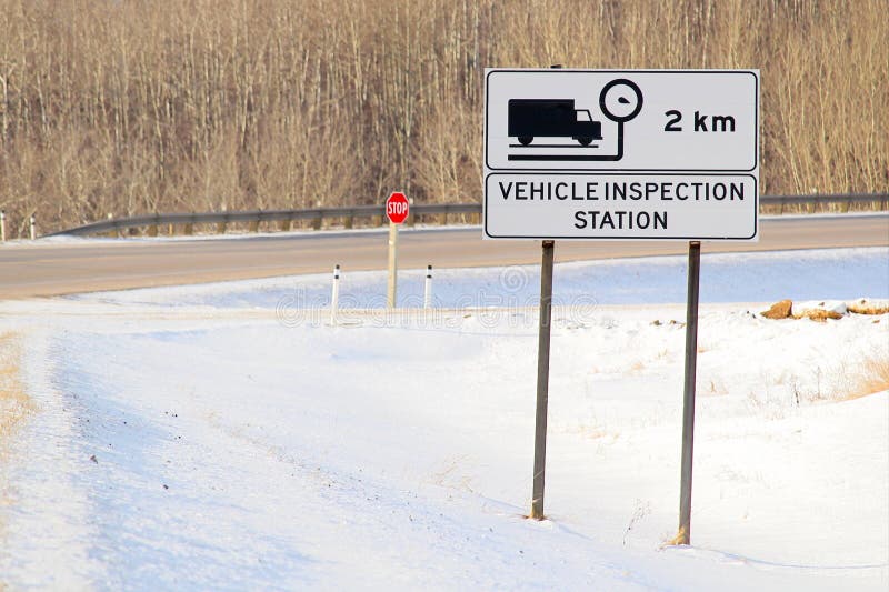 Vehicle Inspection Ahead Sign with Highway in the Background Stock ...