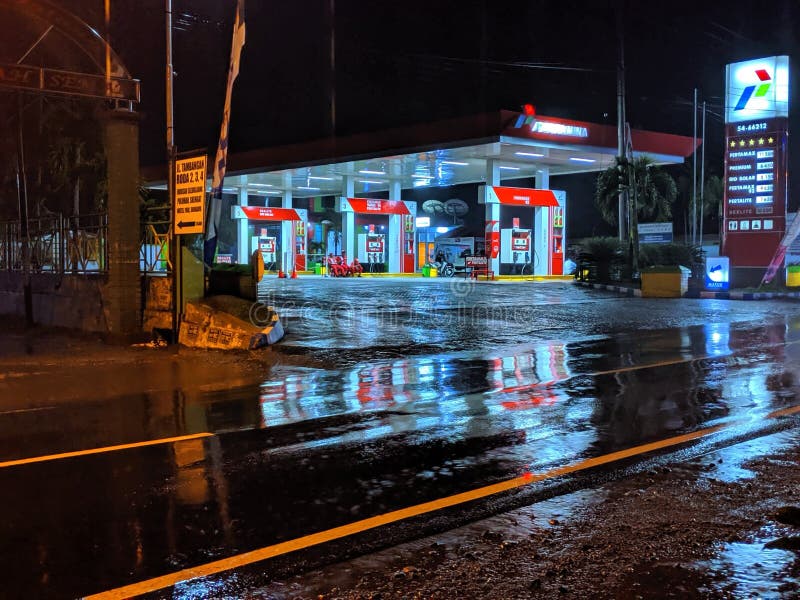 A Vehicle Refueling Visible at Night Editorial Image - Image of water ...
