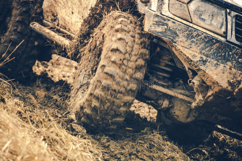 Mud-covered Vehicle Navigating through Tough Terrain in an Off-Road ...