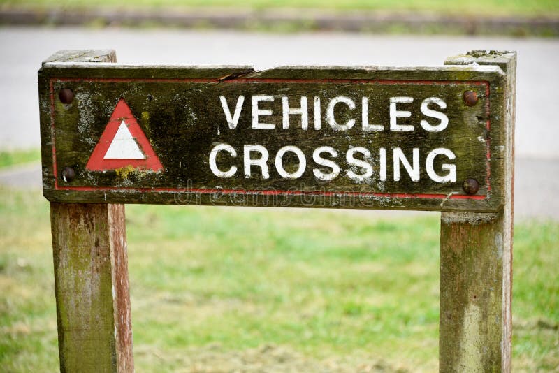 Vehicles Crossing Sign stock image. Image of roadsign - 57855577