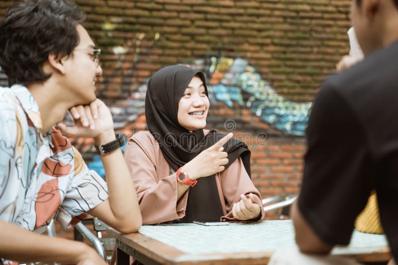 Veiled Female Students Smile while Chatting Stock Image - Image of ...