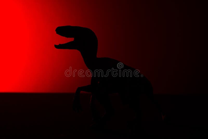 Velociraptor Shadow with Red Light Stock Photo - Image of reptile ...