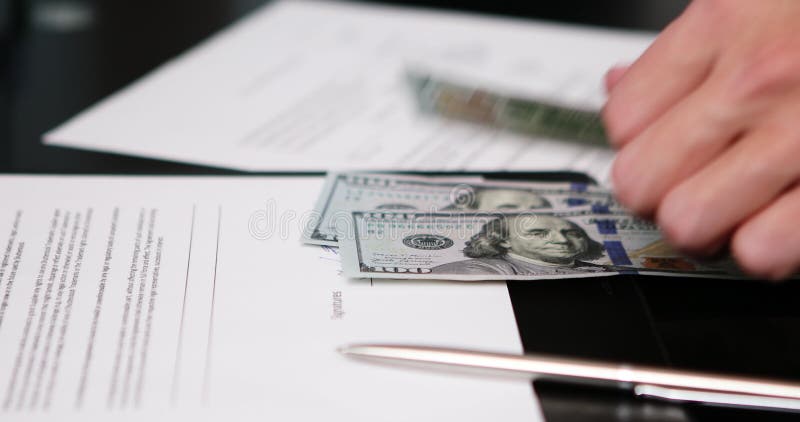 Venality, Bribe, Corruption Concept. Man Inserts Financial Bribe in an ...