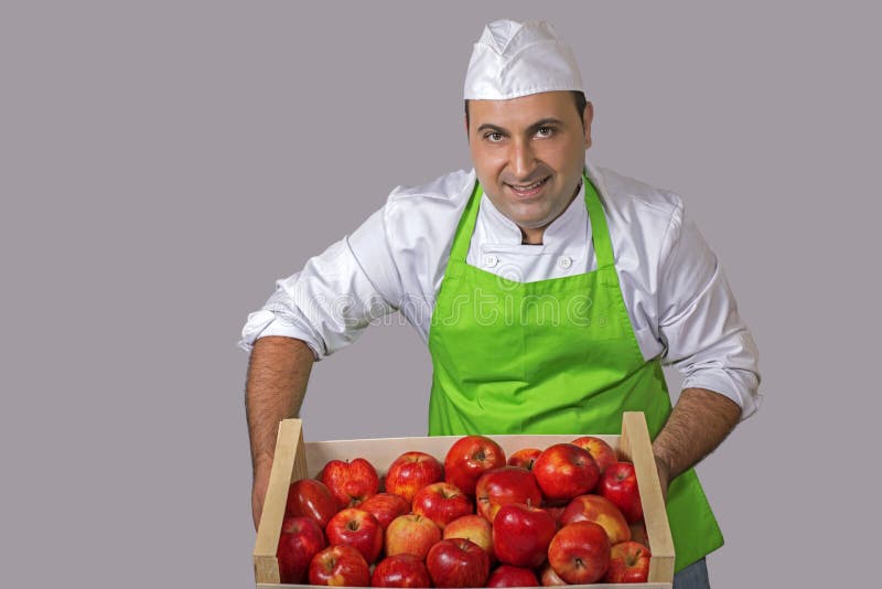 Vendedor De La Fruta Con La Caja De Manzanas Imagen de archivo - Imagen ...