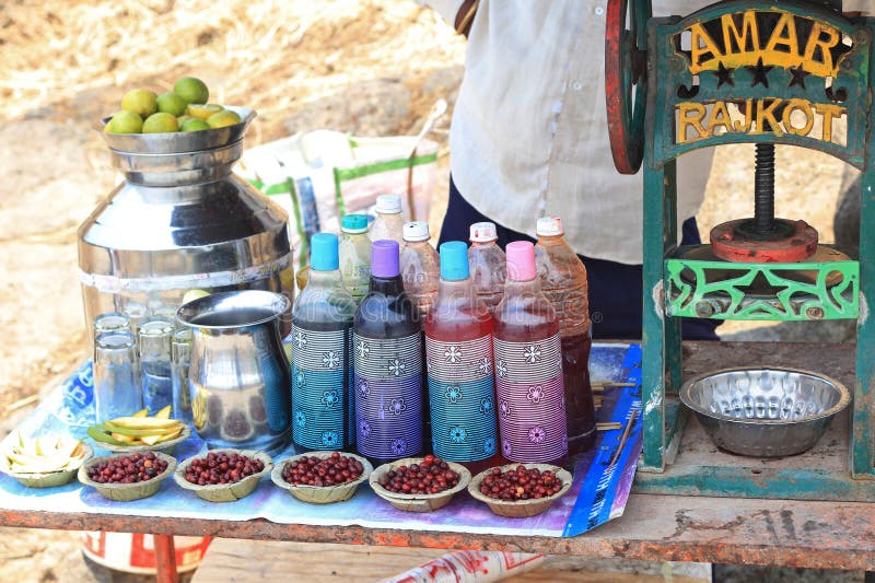 Vendor Displaying Raw Mango Cut Pieces , Red Berries , Cold Drinks with ...