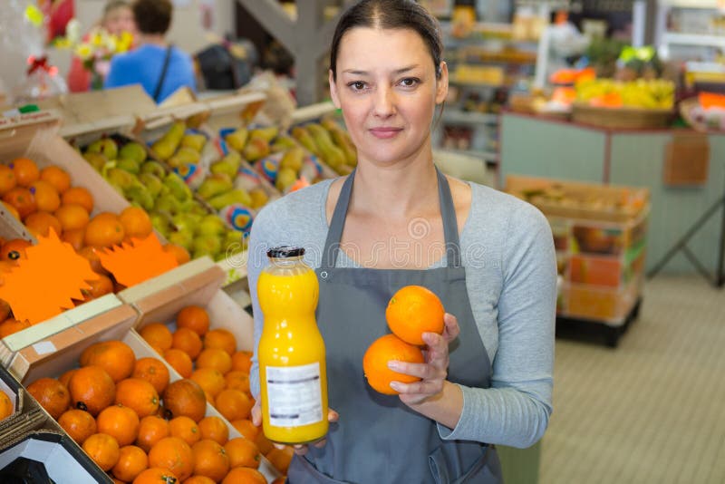 Vendor Holding Fruit Orange and Juice Orange in Container Stock Image ...