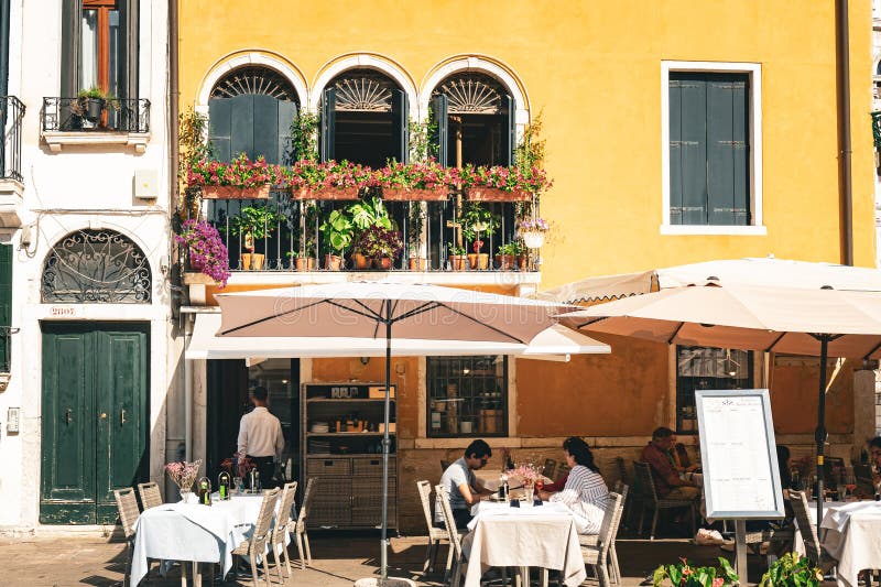 Restaurant Tables and Chairs in a Small Square in Venice, Italy ...