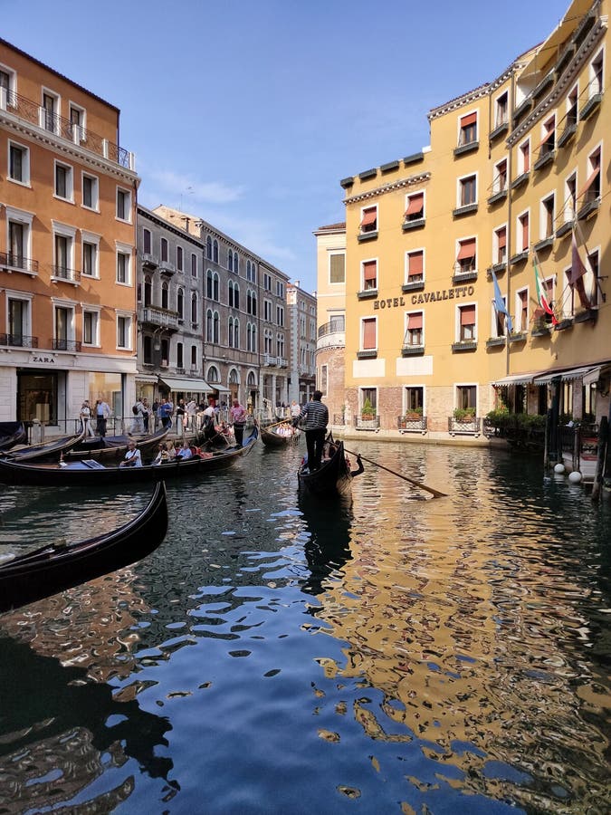 Venice, Italy - October 5, 2023: Gondolier at Work in Venice with Canal ...