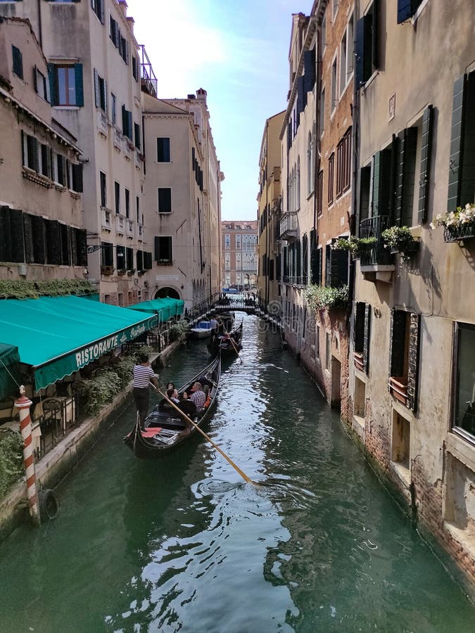 Venice, Italy - October 5, 2023: Gondolier at Work in Venice with Canal ...