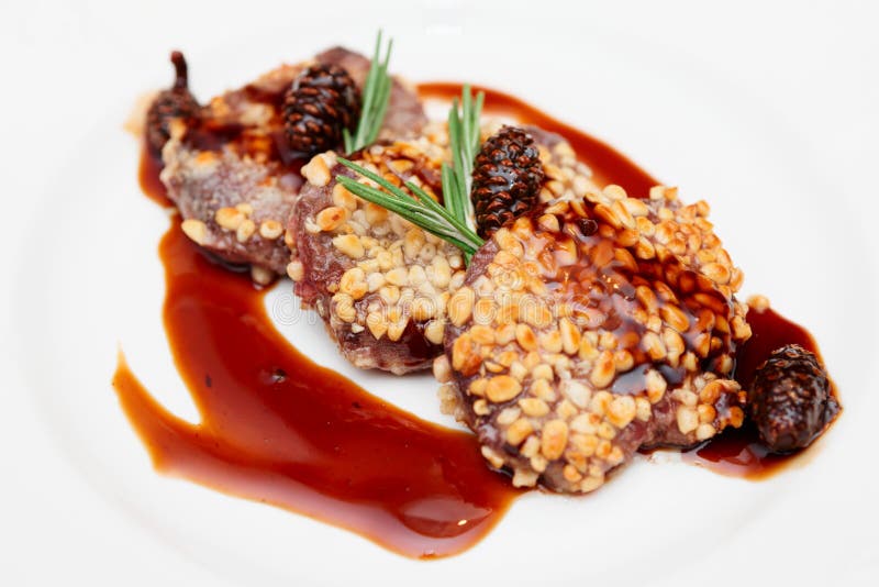 Venison Fillet Fried with Pine Nuts in Plate Stock Photo - Image of ...
