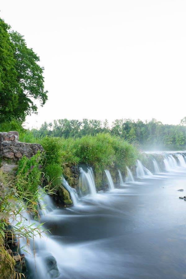 Venta Rapid Waterfall in a Long Exposure Vertical Shot Stock Image ...