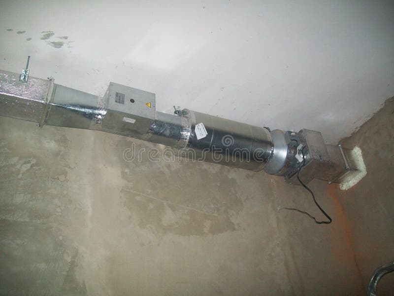 Ventilation Duct Installation in a Basement Setting with Electrical ...