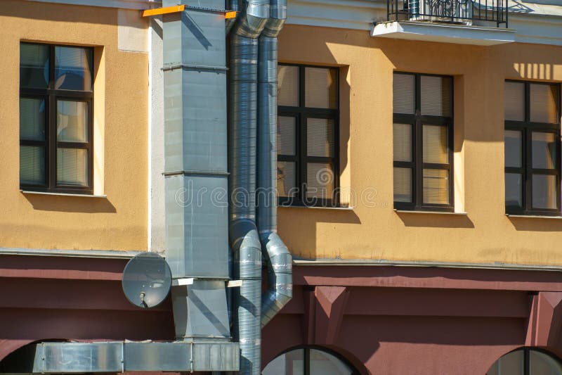 Ventilation Pipes on the Facade of the Building. Metal Pipes Covered ...