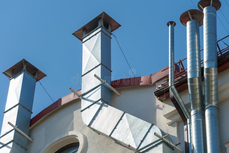 Ventilation Pipes on the Facade of the Building. Metal Pipes Covered ...