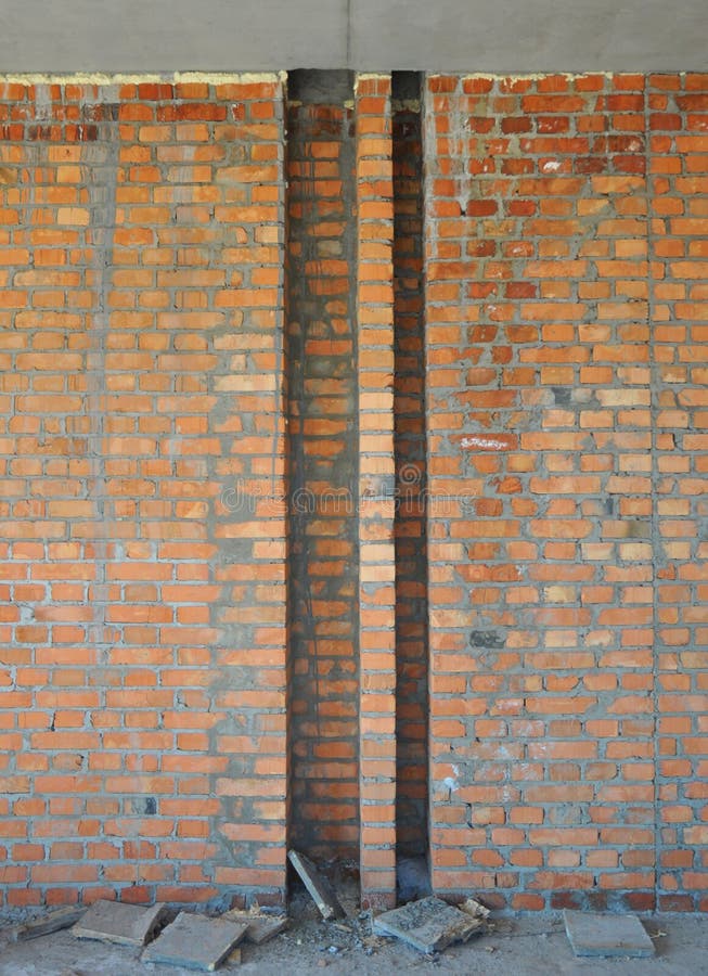 Ventilation and Plumbing Ducts in a Brick Wall Inside a House Being ...