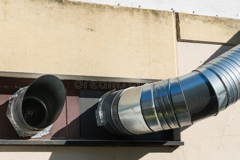 Ventilation System Installation on a Building Wall during Daylight ...