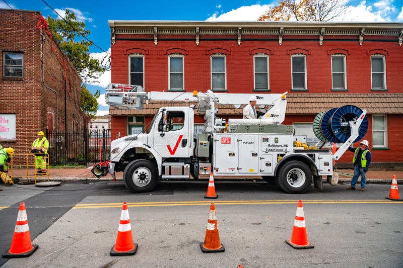 Verizon Workmen Lowering Cable into a Manhole (digital Composite ...