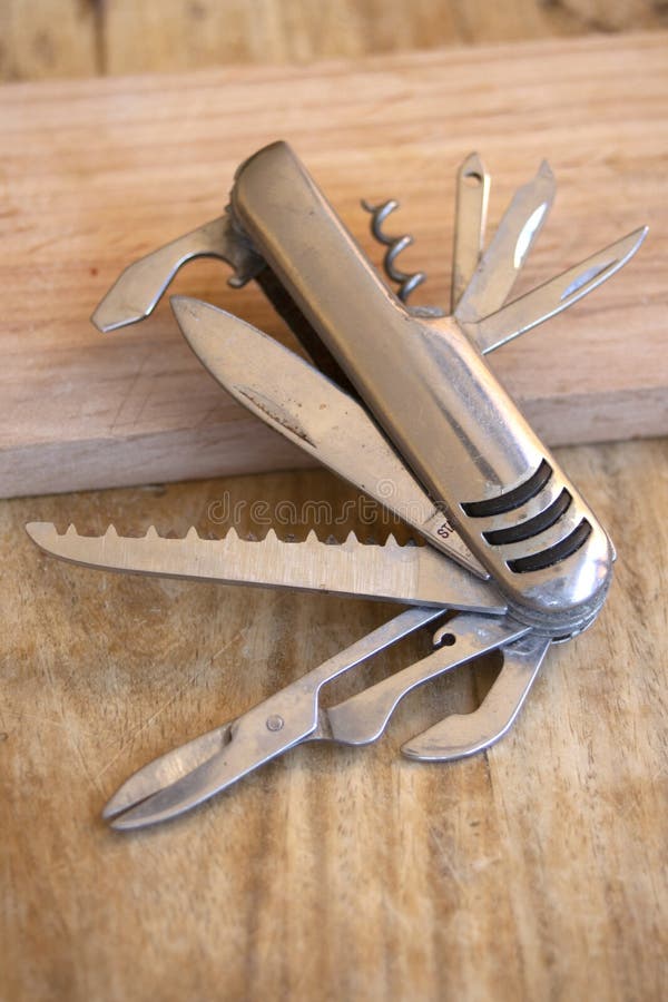 Open Silver Multi-Tool Knife on Wood Stock Image - Image of stainless ...